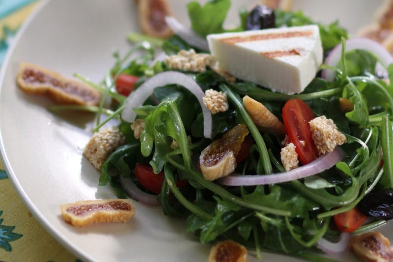 Arugula Salad with Dried Figs, Olives & Pasteli (Sesame bar)